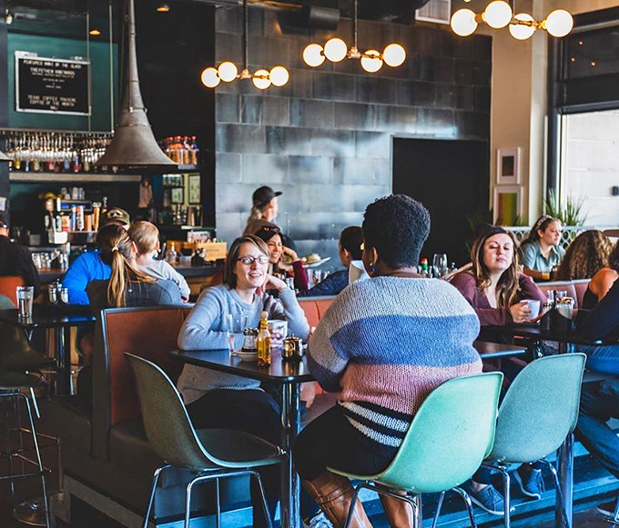 The dining room hums with the universal language of satisfaction. Notice how nobody's looking at their phones? That's the power of good food.