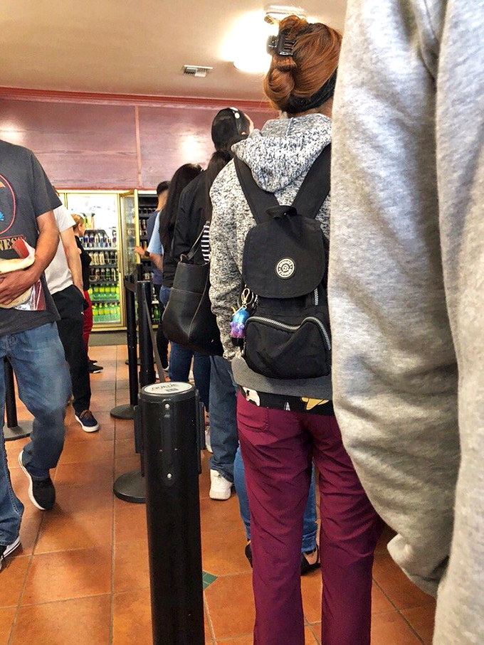 The universal language of great food: people willing to wait in line. When strangers gather this patiently, you know culinary treasure awaits.