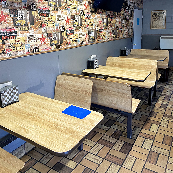 Retro diner seating with walls plastered in memorabilia&mdash;where every booth feels like you've scored the best seat in the house.