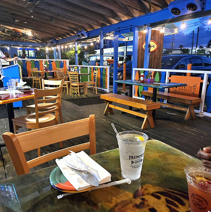 The dining deck: where wooden tables, sea breezes, and the promise of seafood create the holy trinity of Florida dining experiences.
