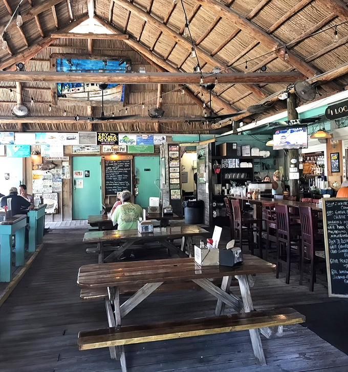 Picnic tables under a thatched roof&mdash;where strangers become friends and nobody's checking their watch or their email.