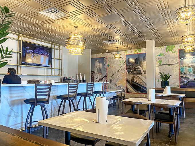 The dining area blends casual comfort with urban sophistication. Those light fixtures alone are worth the visit.