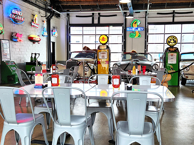 Vintage gas pumps and classic automobiles transform dining into an immersive journey through American automotive history.