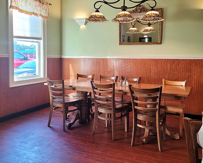 Wood paneling, Tiffany-style lamps, and sturdy wooden chairs&mdash;this dining space feels like Sunday dinner at grandma's, if grandma fed fifty people at once.