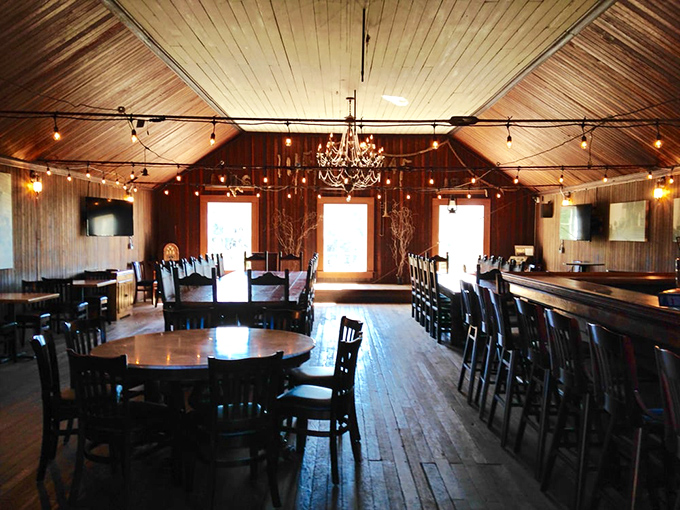 Rustic elegance defines this dining space where string lights and wooden beams create the perfect backdrop for memorable meals and lingering conversations.