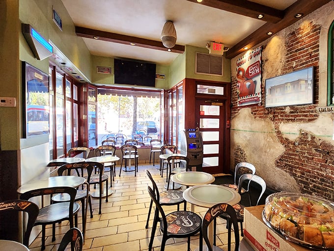 The dining area offers front-row seats to the Market Street hustle while you contemplate the serious business of proper cheesesteak technique.