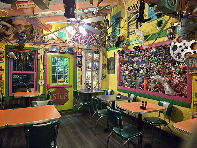 The yellow dining room looks like what would happen if Wes Anderson directed "Alice in Wonderland" as a diner scene.