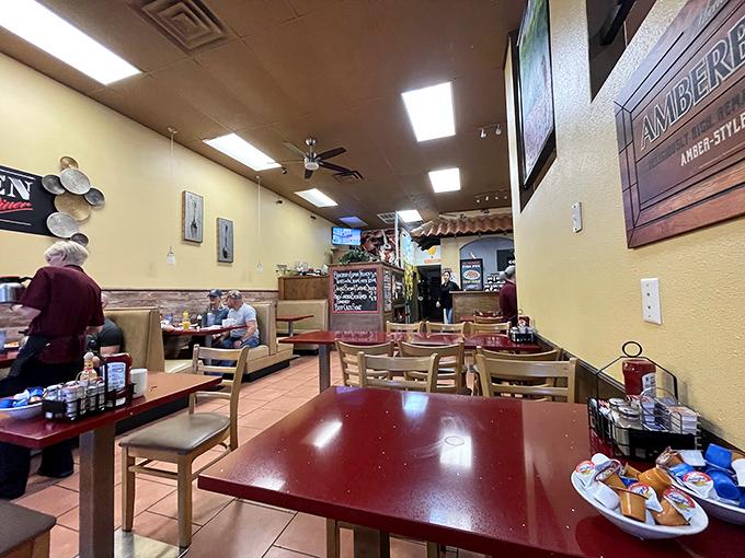 Classic diner seating where every booth tells stories of countless satisfied breakfast adventures.