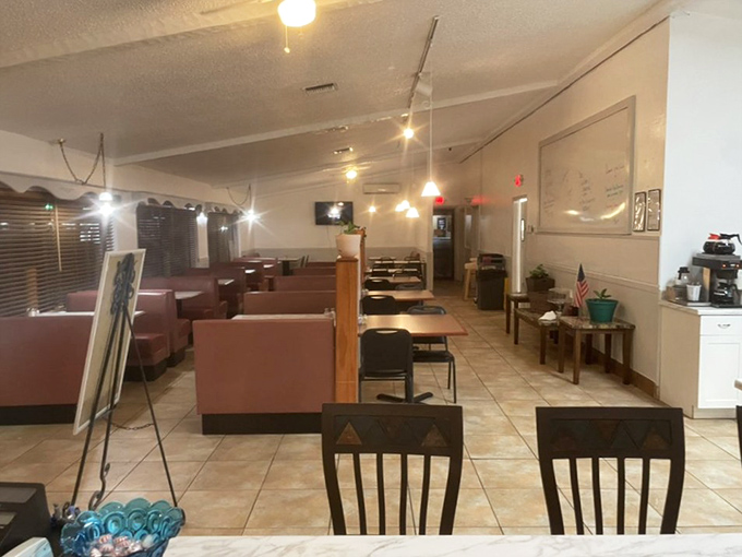 Pink booths that have cradled countless conversations and comforted weary travelers. The simple string lights overhead aren't decoration—they're beacons guiding hungry souls home.