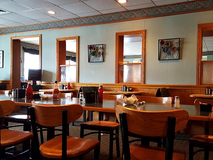 Wood paneling and classic booth seating create an atmosphere where time slows down just enough to savor every bite and conversation.