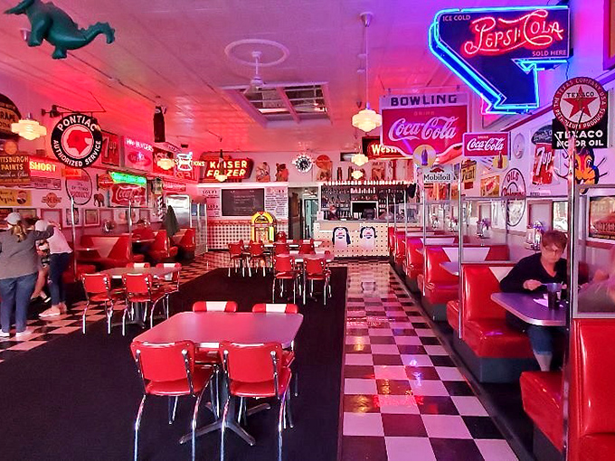 The dining area glows with neon nostalgia&mdash;red vinyl booths and chrome tables transport you to an America where rock 'n' roll was young and milkshakes were considered a food group. 