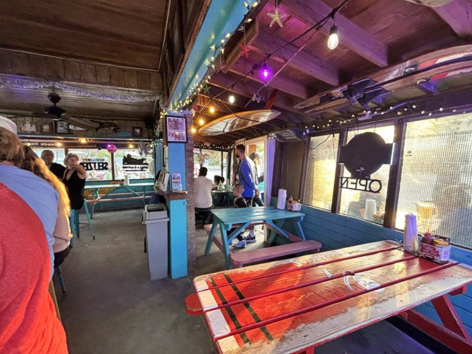 Picnic tables under string lights create the kind of atmosphere money can't buy but memories are made of. 