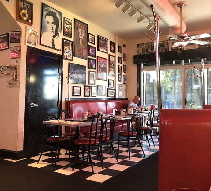 Elvis watches over diners from his place of honor on the wall, as if to say, "Thank you, thank you very much" for choosing Tommy's.