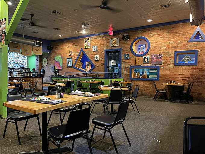 Every table tells a story at Pecan Lodge, where exposed brick and thoughtful design create the perfect backdrop for barbecue memories.