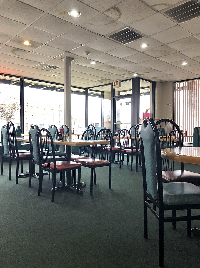 The dining room waits expectantly, each table an empty canvas about to become the backdrop for flavor adventures.