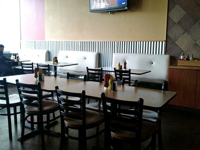 Simple, comfortable seating that says, "Stay awhile, but we both know you're here for the food." Priorities in perfect order.