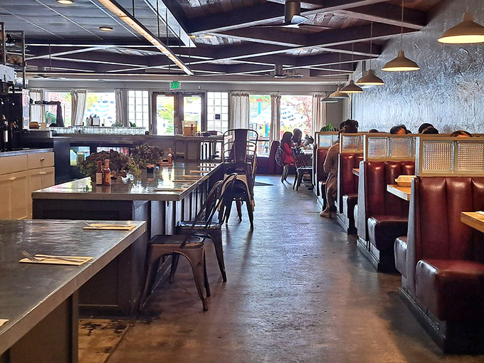 The dining room hums with anticipation and satisfaction in equal measure. Every table holds the promise of imminent deliciousness.