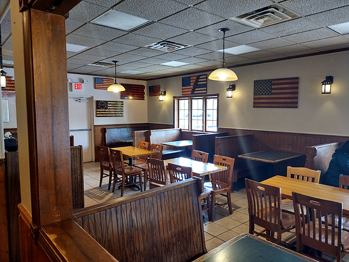 American flags adorn walls where generations have plotted their ice cream strategy. Democracy in action: everyone gets a booth.