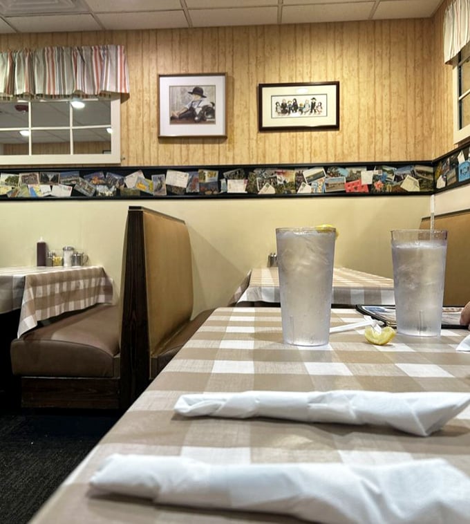 Wood paneling and postcards create the perfect backdrop for conversations that linger longer than your coffee ever will. 