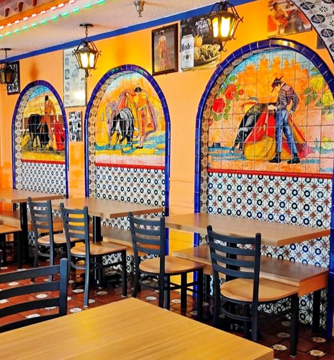 The dining area's warm orange walls and hanging lanterns create the perfect backdrop for the food memories you're about to make.