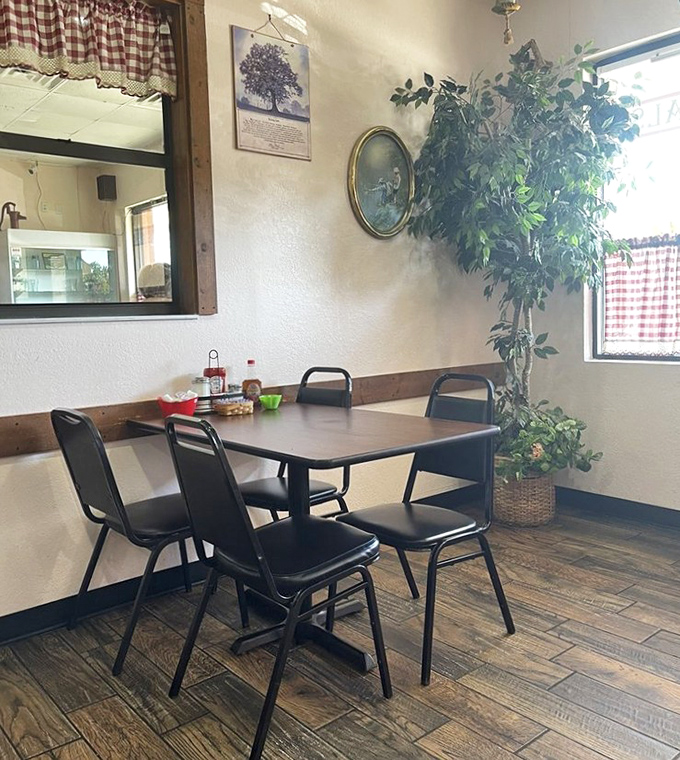 Simple tables, checkered curtains, and a plant that's seen generations of breakfast debates. This is where memories are made between coffee refills.