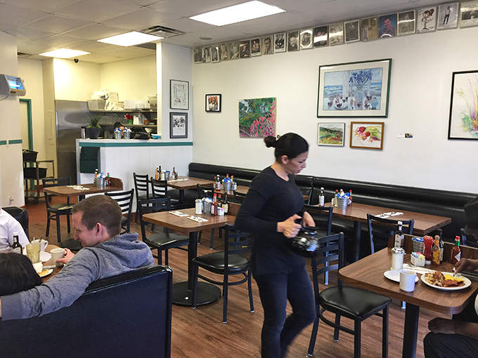 Art on the walls, food on the tables, and conversations in the air. The diner's natural ecosystem functioning exactly as nature intended.