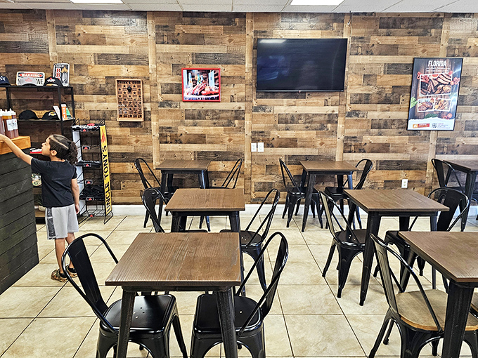 Simple tables, metal chairs, and wood-paneled walls create the perfect stage where the real stars&mdash;smoked meats&mdash;can shine without distraction.