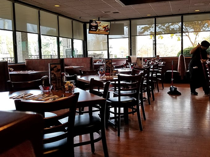Light streams through large windows, illuminating a dining space where memories are made between bites of perfect breakfast.