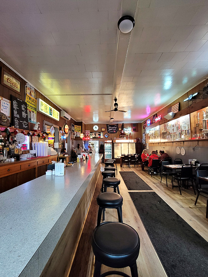 The narrow dining area where strangers become friends, united by the universal language of "you've got to try this sandwich."