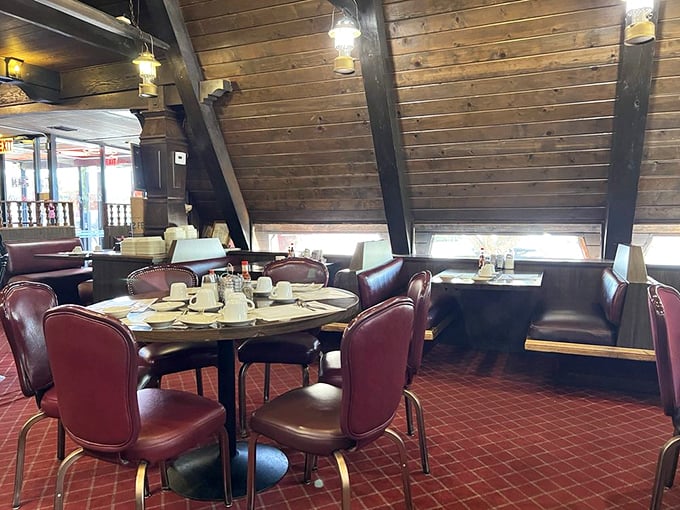 Red chairs and wooden beams create the perfect setting for breakfast diplomacy. Many world problems could be solved if only negotiated over plates of eggs here.