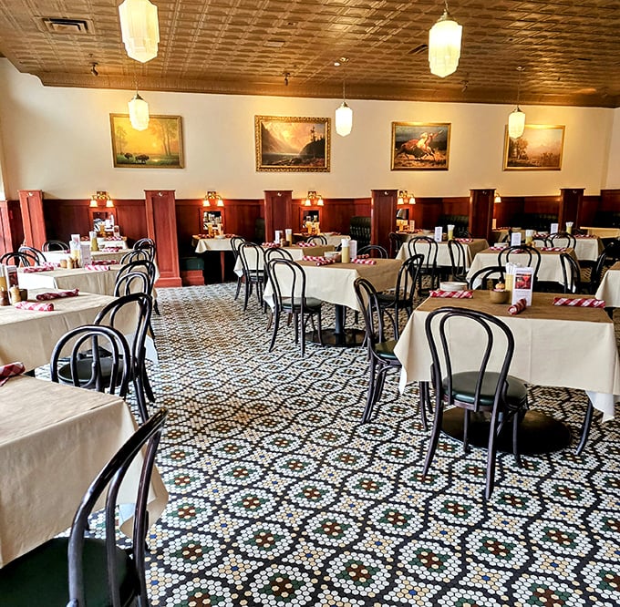 White tablecloths meet Western charm in a dining room where every detail feels intentional, from pendant lights to carefully spaced tables.