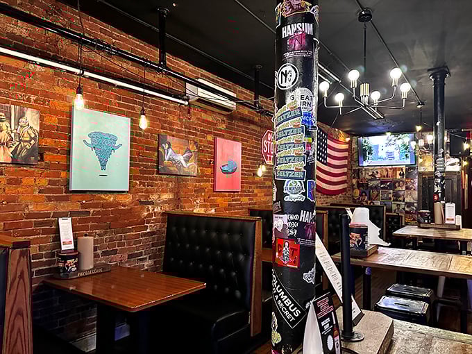 The dining area feels like the coolest friend's apartment&mdash;exposed brick, quirky art, and a pillar plastered with stickers documenting good times past.