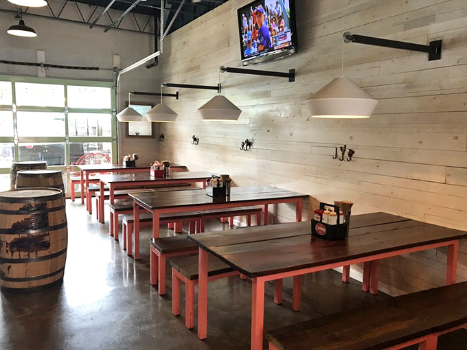 Communal tables and whitewashed walls create a dining space that feels like the coolest friend's garage after they decided to get serious about entertaining.