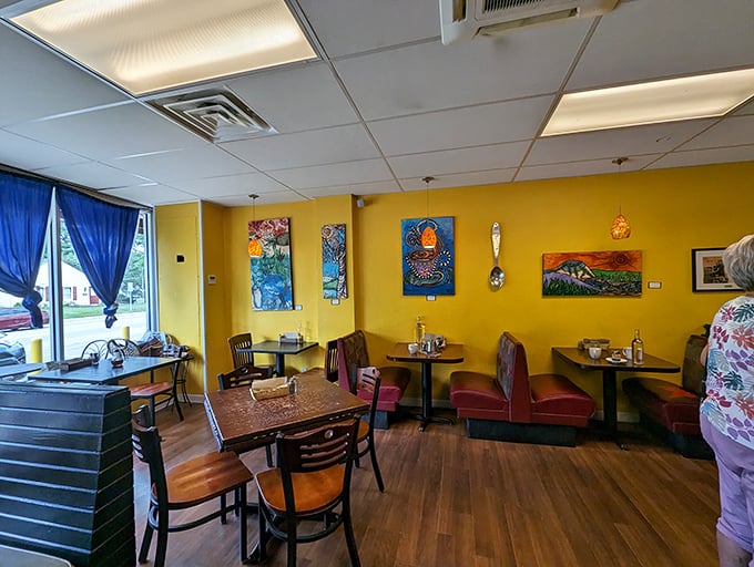 Sunny yellow walls and local artwork transform dining into a multi-sensory experience. Even the giant spoon on the wall seems to be saying "dig in!"