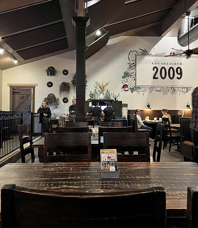 The dining area feels like the living room of that friend who actually knows how to cook, complete with exposed beams and "established 2009" pride.