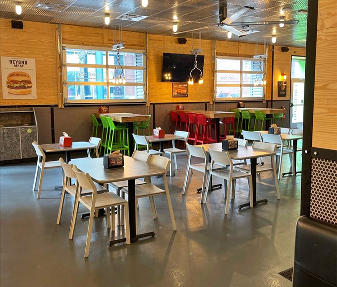 Clean lines, natural light, and those signature red and green chairs create a space that says "stay awhile." Fast-casual dining that doesn't rush you out.