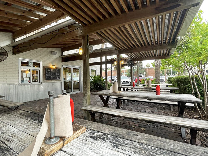 The covered outdoor dining area offers the perfect blend of "at the beach" and "not getting sunburned while you eat." Rustic comfort at its finest.
