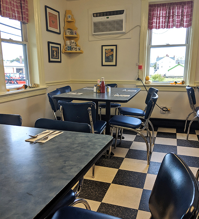 The dining area whispers of countless morning conversations, blue chairs waiting patiently for the next round of pancake enthusiasts.