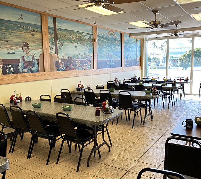 The murals tell stories while the tables wait for yours. This isn't interior design&mdash;it's a community gathering space with character that chain restaurants can only dream about.