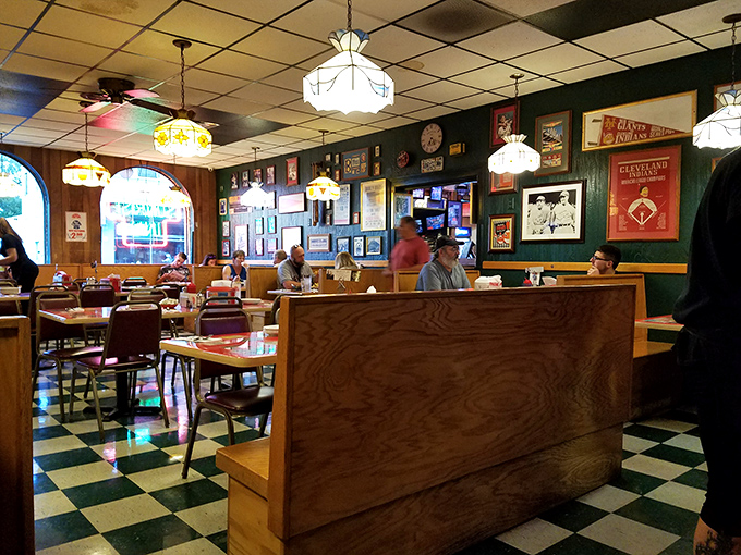 The dining room buzzes with conversation, laughter, and the universal language of satisfied diners.