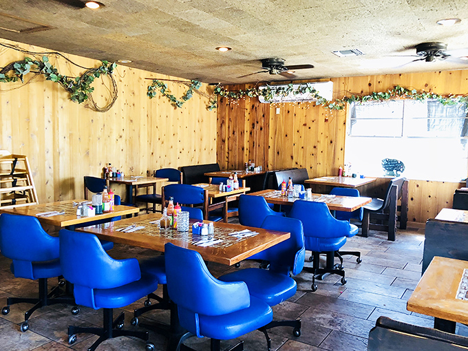 Blue chairs that pop against pine walls &ndash; simple, unpretentious dining quarters where the food, not the decor, rightfully takes center stage.