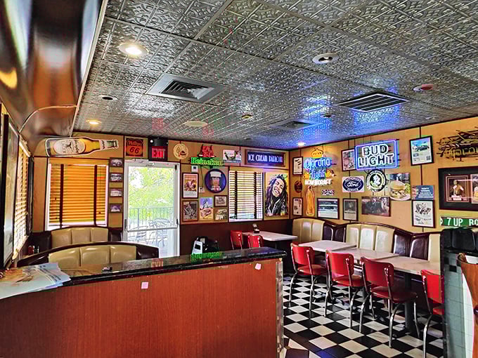 The bar area: where neon signs and checkered floors create the perfect backdrop for life's important decisions, like "pie or milkshake?"