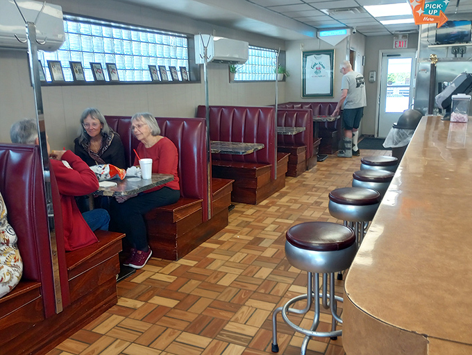 Red vinyl booths and honest atmosphere create the kind of dining experience that feels like coming home.