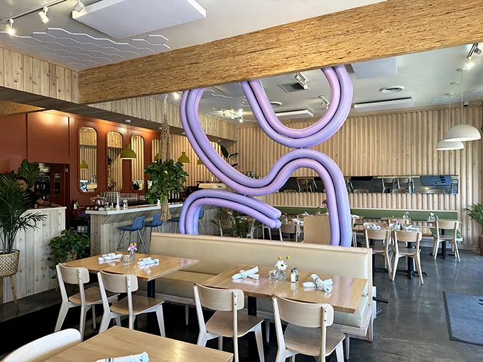 That sculptural purple swirl isn't just decor &ndash; it's conversation-starting art. Breakfast with a side of California cool.