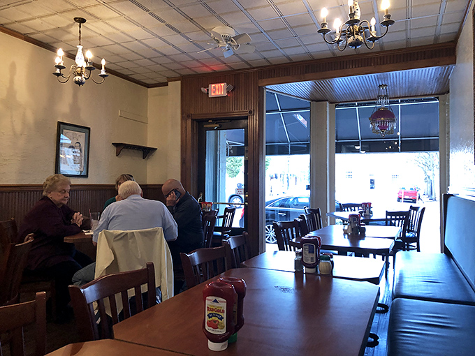 The dining room at Ron's strikes that perfect balance between "been here forever" and "feels like home," where chandeliers cast a warm glow over decades of memories.