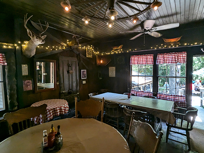 String lights and mounted deer heads create the perfect rustic ambiance for serious comfort food conversations.