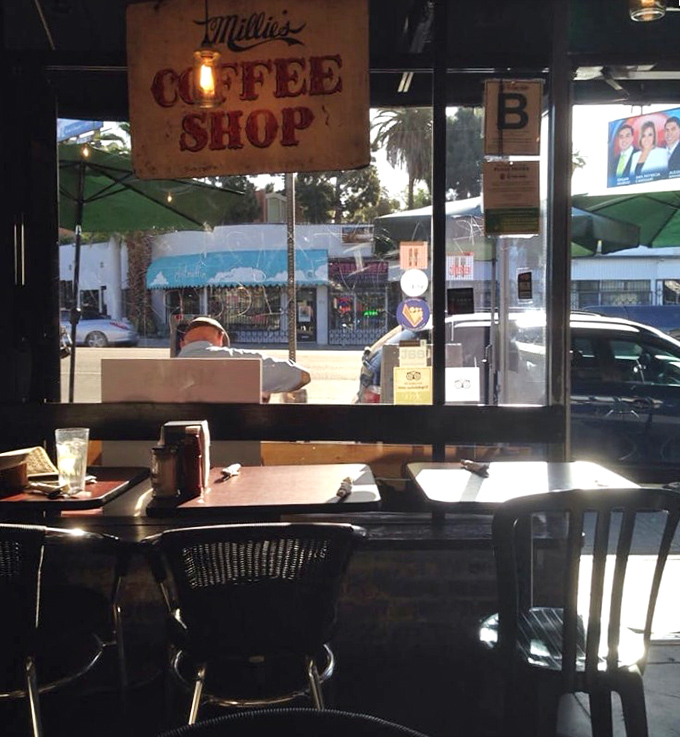 That "Coffee Shop" sign isn't just decoration&mdash;it's a promise that civilization and caffeine await inside those sunny windows.