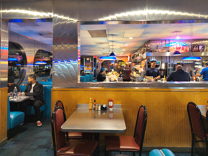 Behind that pass-through window, breakfast symphonies are composed. The blue booths and mirrored walls create the perfect acoustics for the music of satisfied sighs.