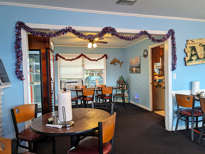 Holiday tinsel meets maritime charm in this dining room where every table feels like the captain's table. The light blue walls echo the nearby Gulf waters. 