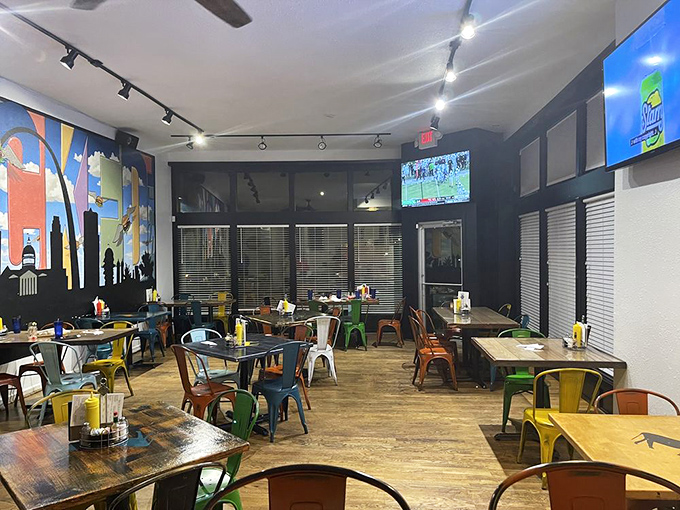 Colorful chairs scattered like confetti across wooden floors, creating the perfect backdrop for food that demands to be photographed before eaten.